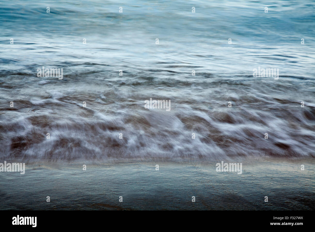 Blue ocean wave in motion Stock Photo - Alamy