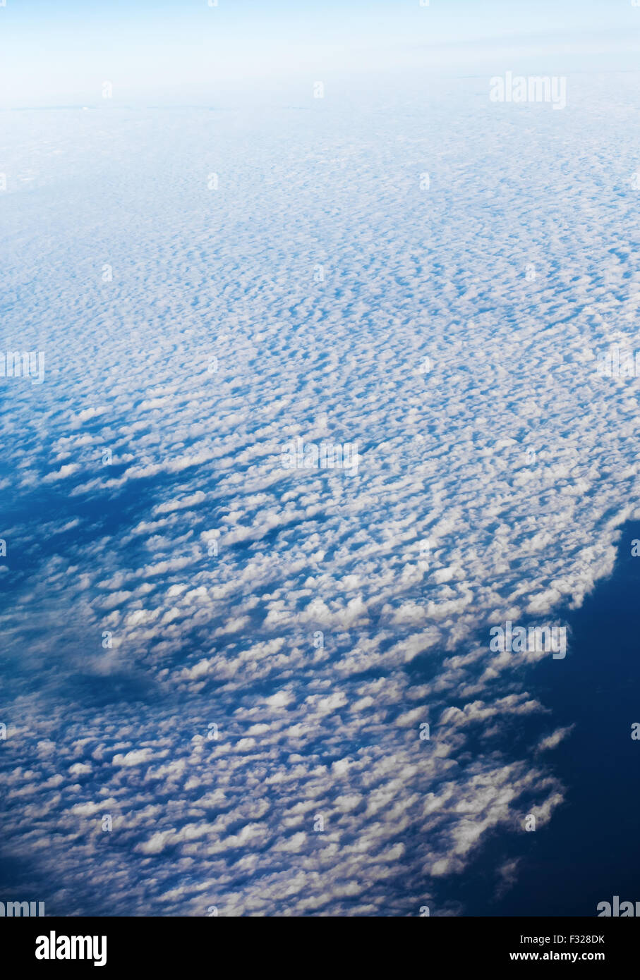 Above the clouds. Top view from the airplane in the sky and clouds ...