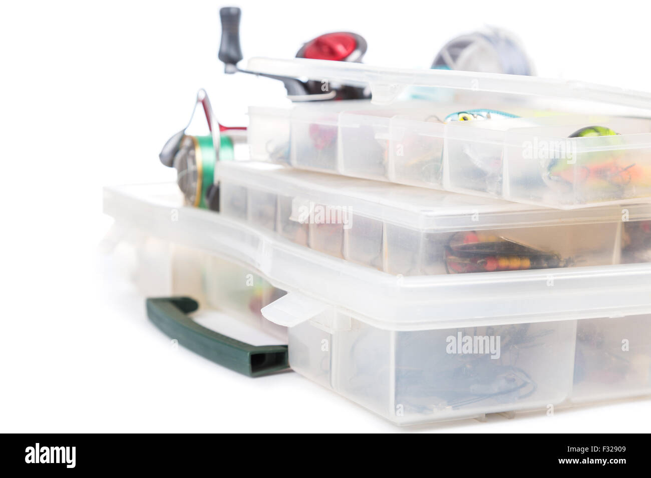fishing baits and lure in transparent plastic storage boxes on bright ...