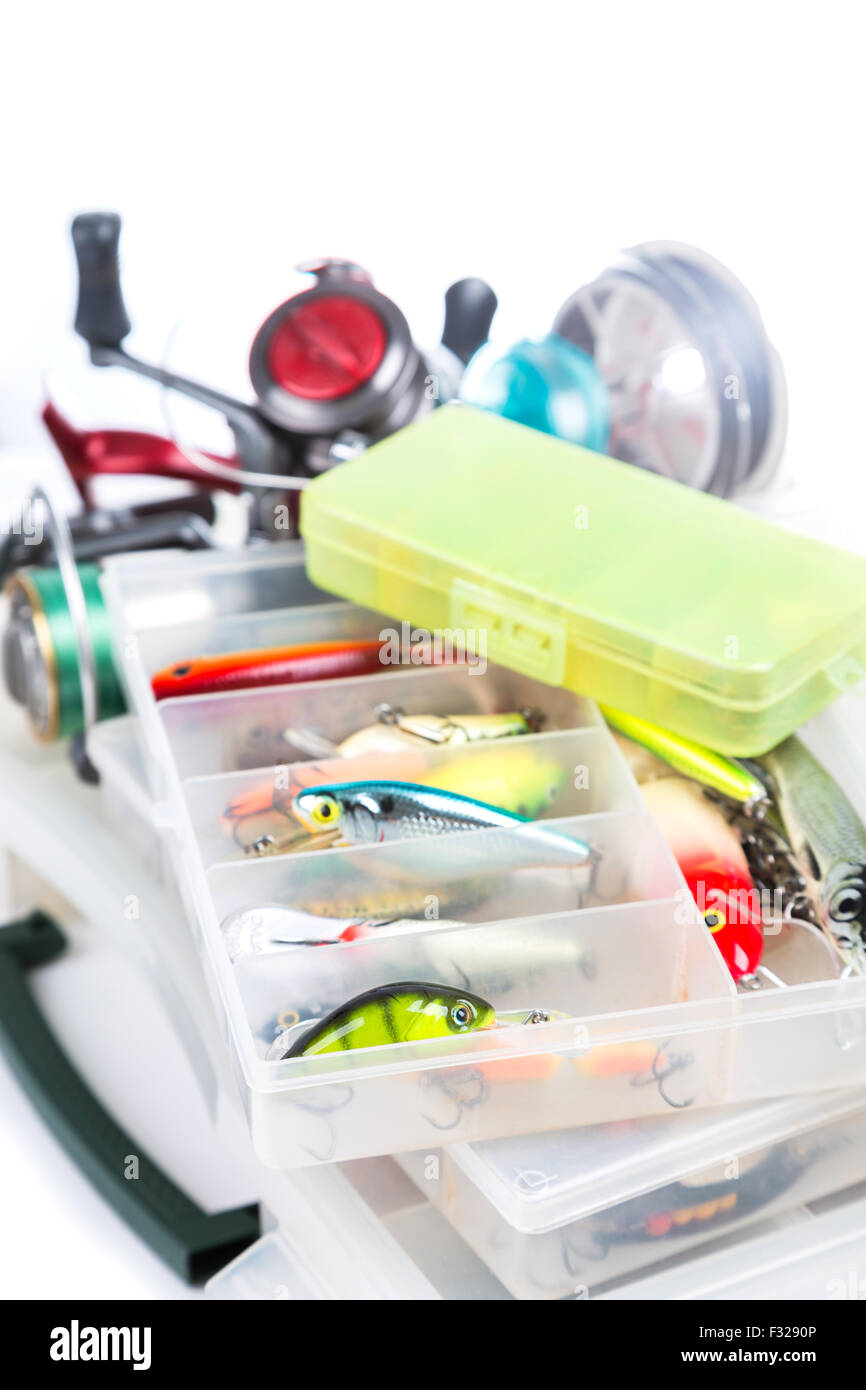 fishing baits and lure in transparent plastic storage boxes on bright ...