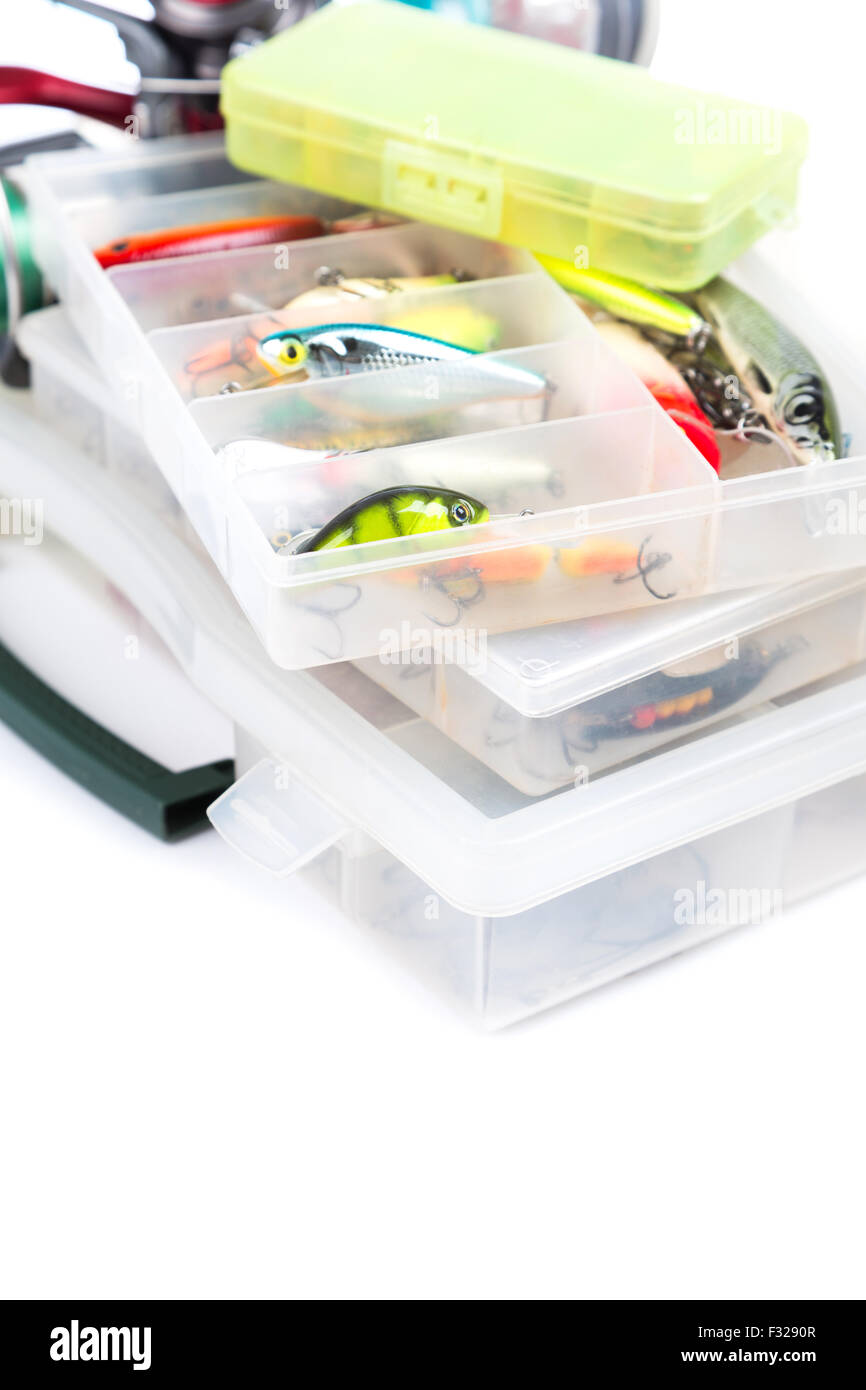 fishing baits and lure in transparent plastic storage boxes on bright ...