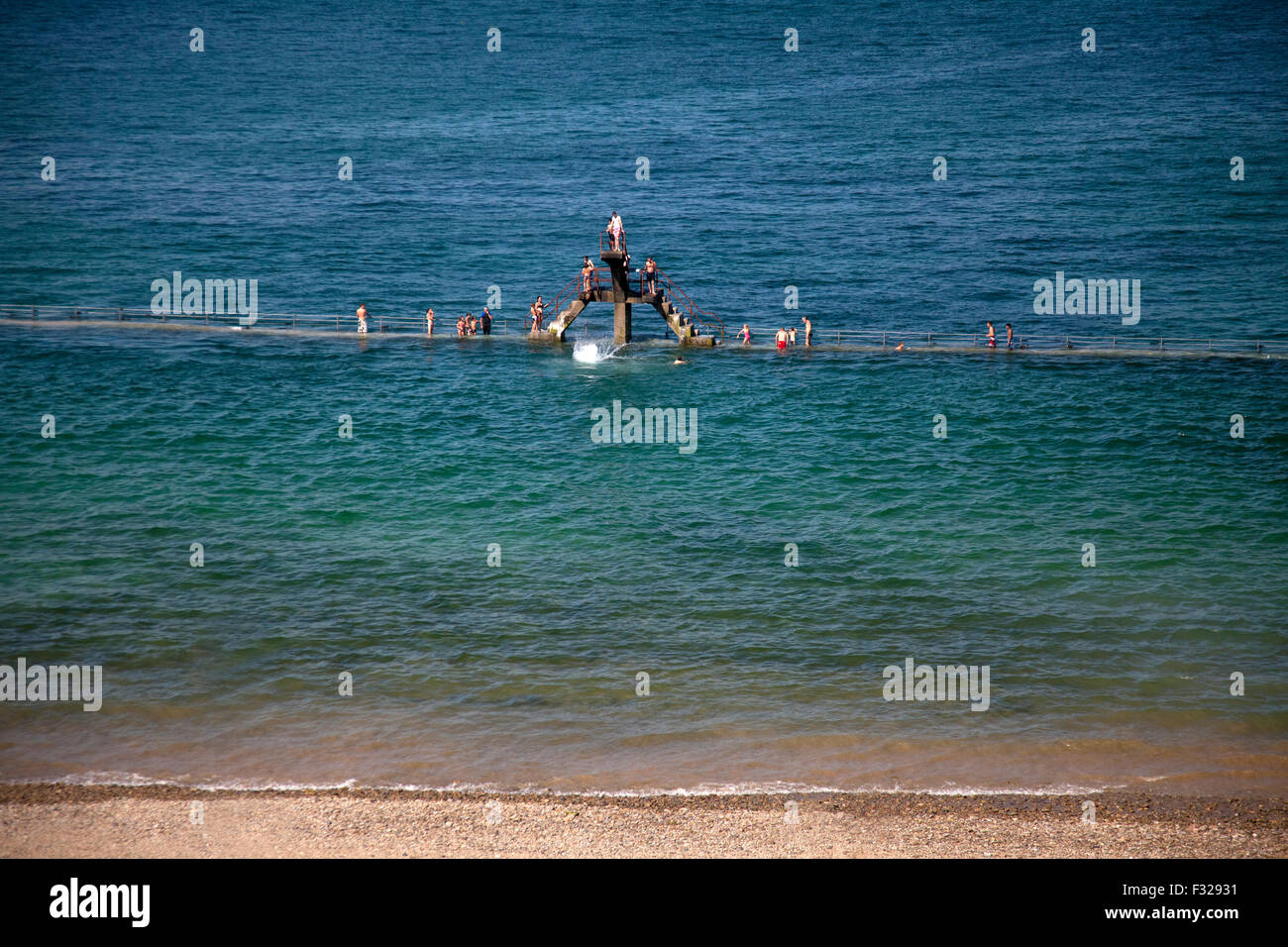 People diving into an outdoor swimming pool, Saint Malo Stock Photo - Alamy