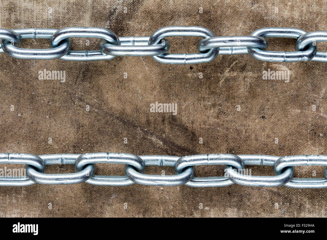 Two chains crossing old book cover, with copy space Stock Photo - Alamy
