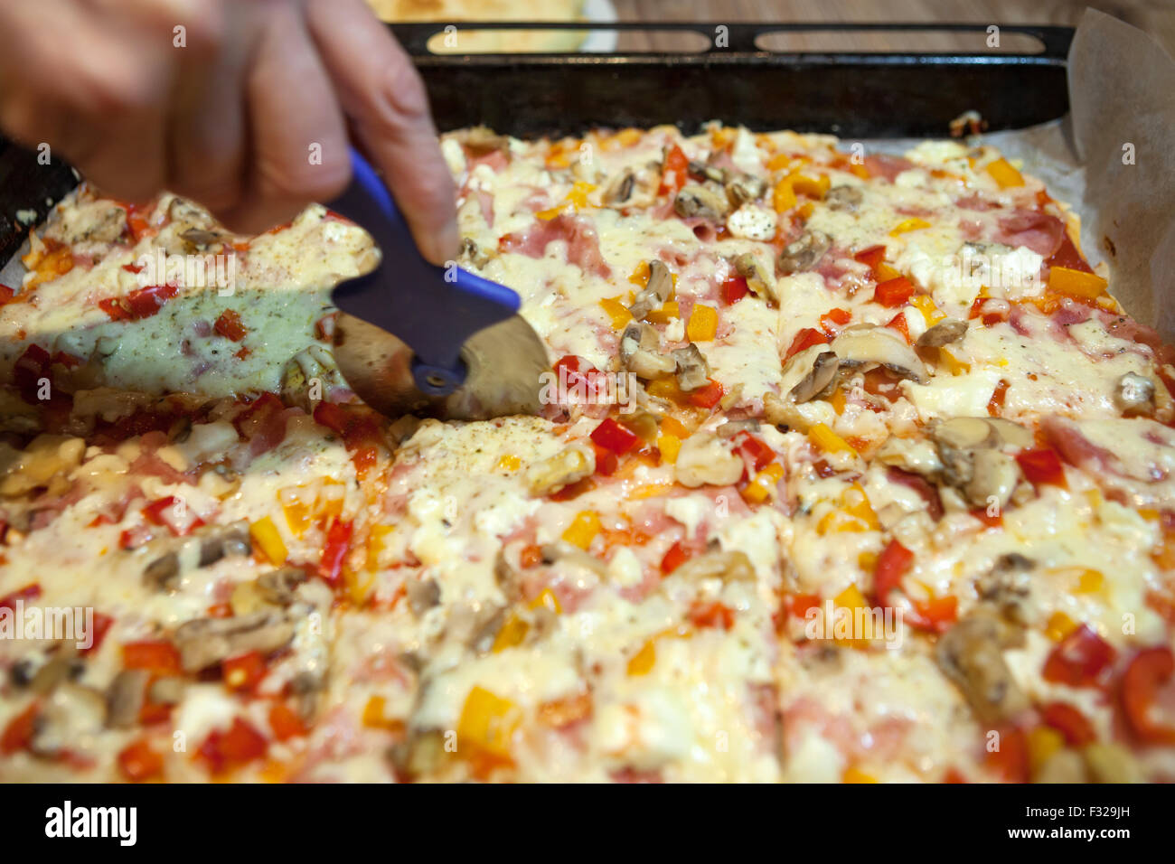 Cutting Homemade Pizza Stock Photo - Alamy