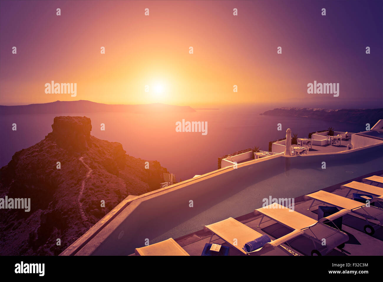 Image of a Santorini pool at sunset Stock Photo - Alamy
