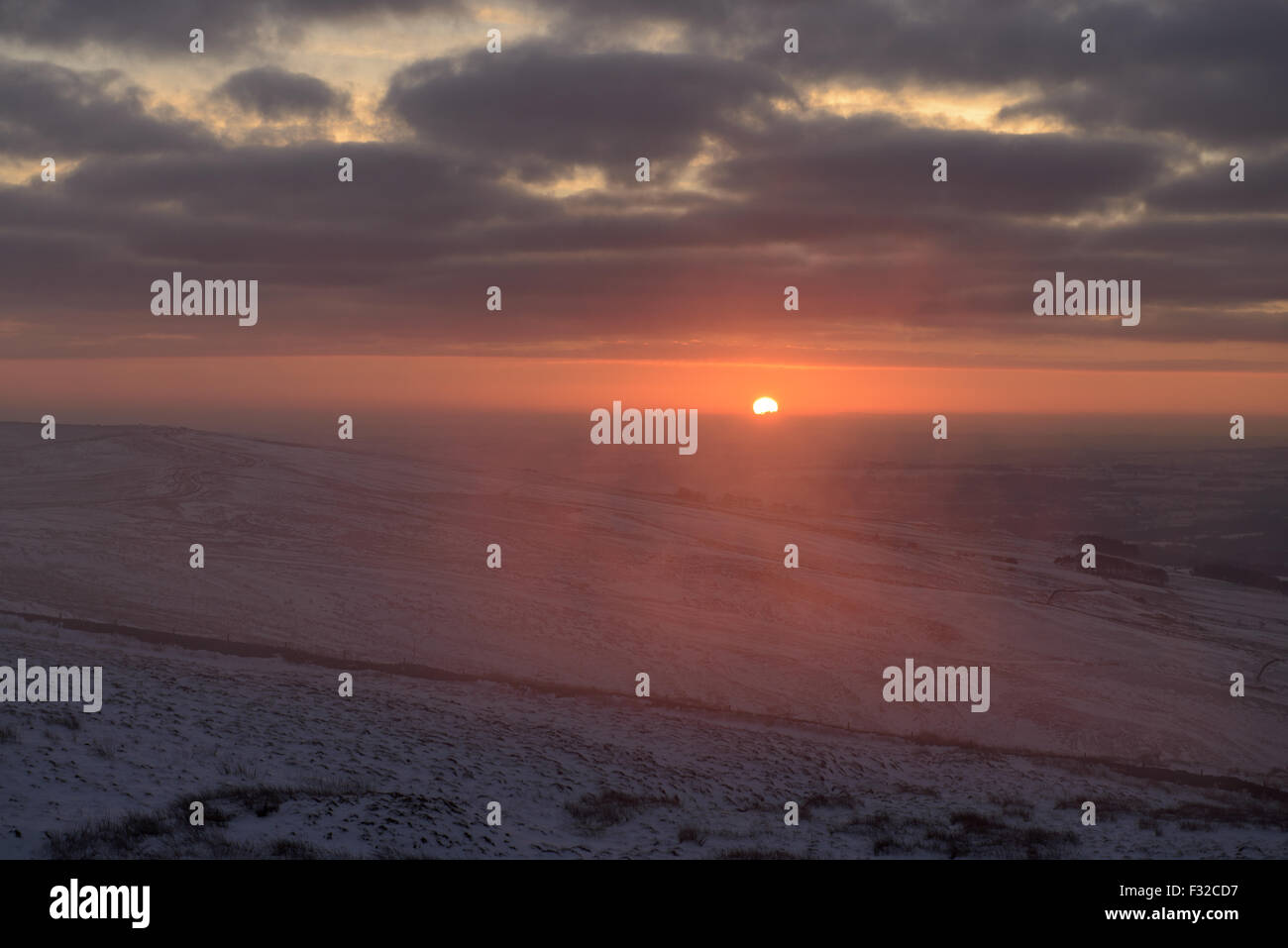 View of snow covered moorland at sunset, Blackshaw Moor, North ...