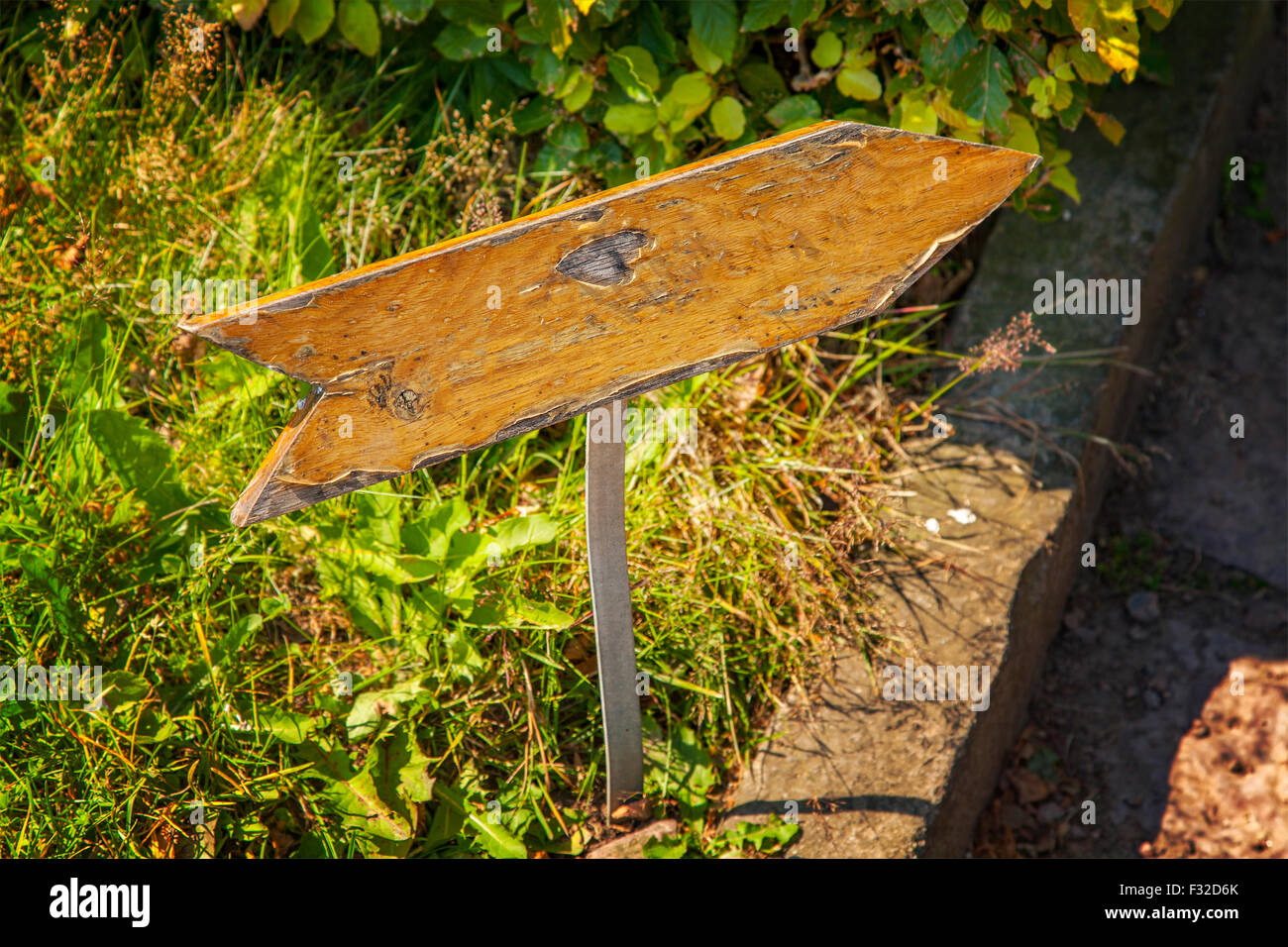 Image of a worn old wooden arrow signpost Stock Photo - Alamy