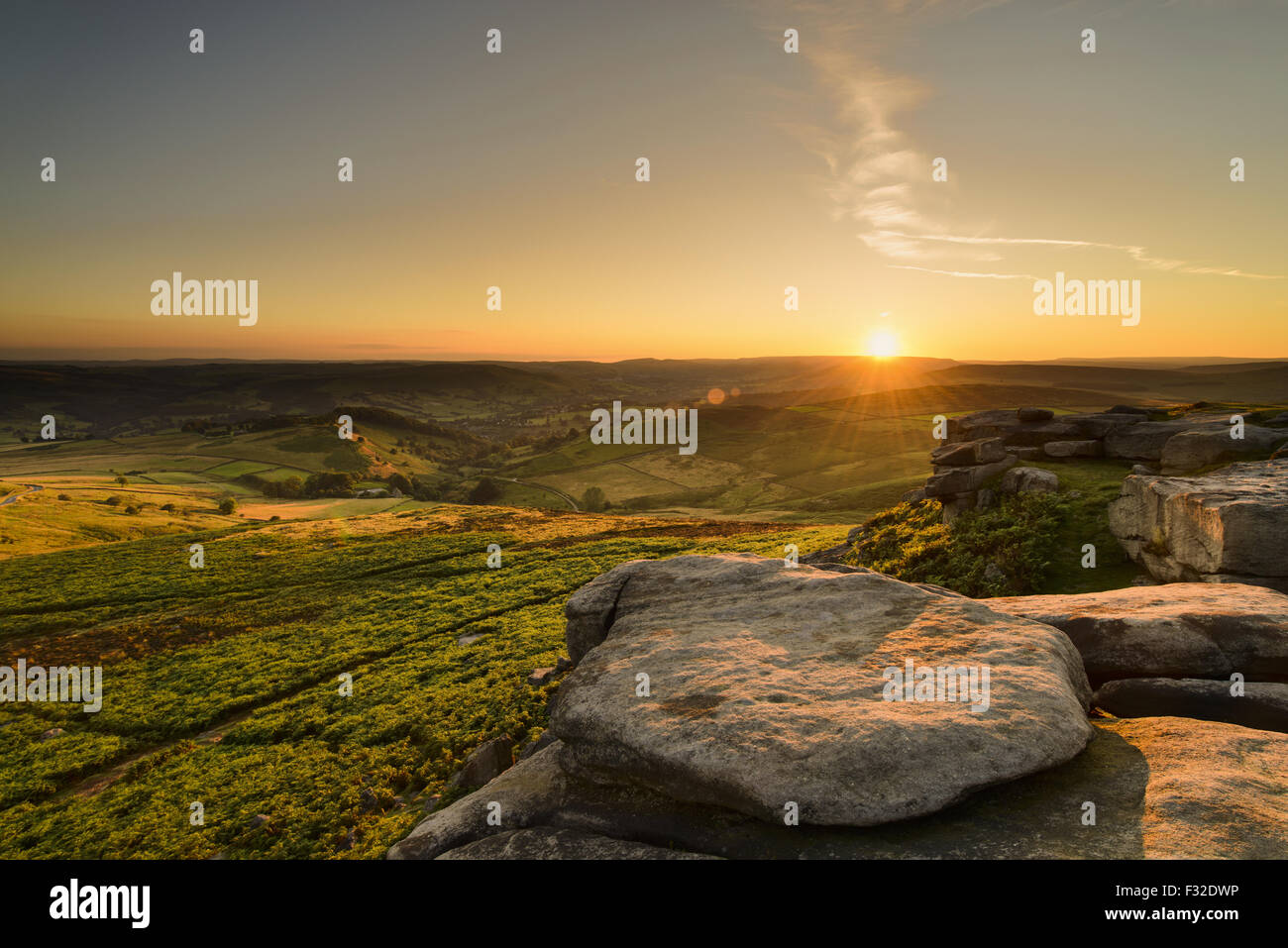 View of gritstone tor overlooking valley at sunset, Higger Tor, Dark ...