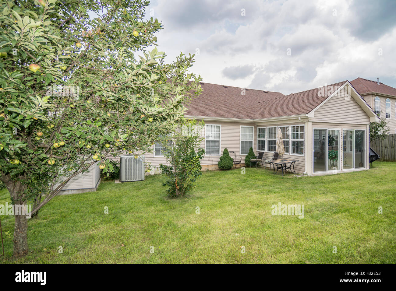 American middle class suburban house with sunroom Stock Photo - Alamy