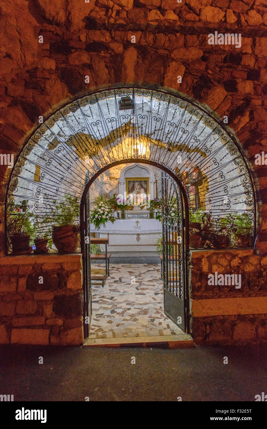 Small chapel in a grotto Stock Photo - Alamy