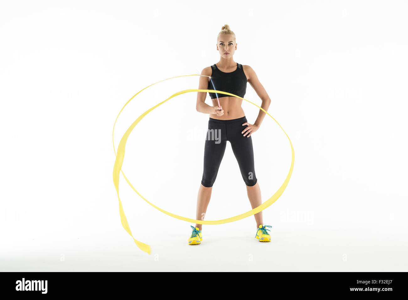 Rhythmic gymnast doing exercise with a ribbon Stock Photo - Alamy