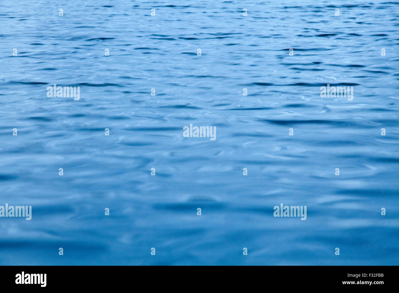 Blue flowing water Stock Photo - Alamy