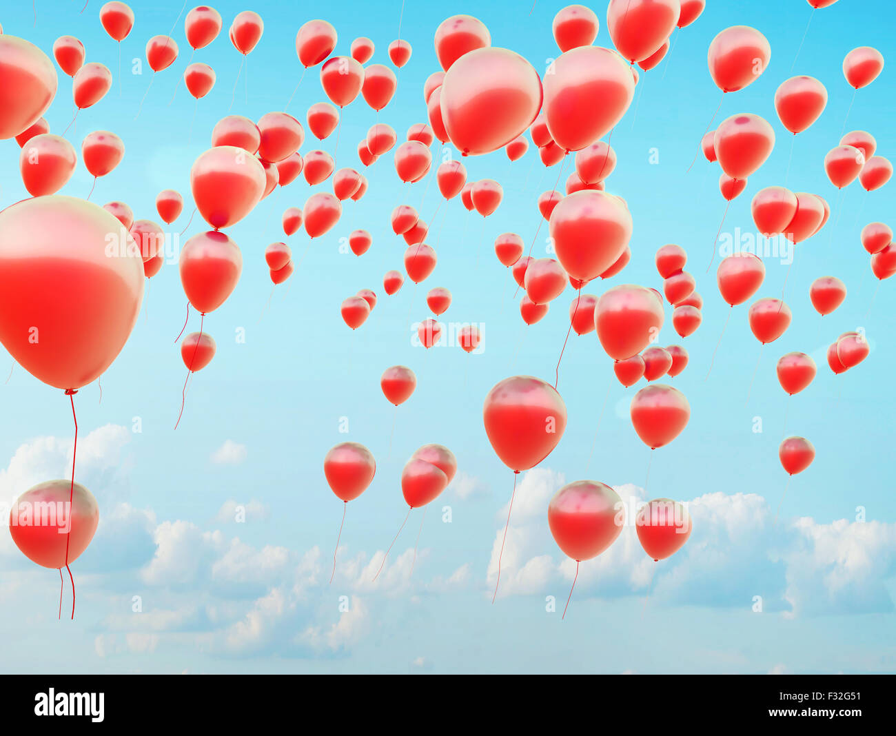 Hundreds of the small red flying balloons Stock Photo - Alamy
