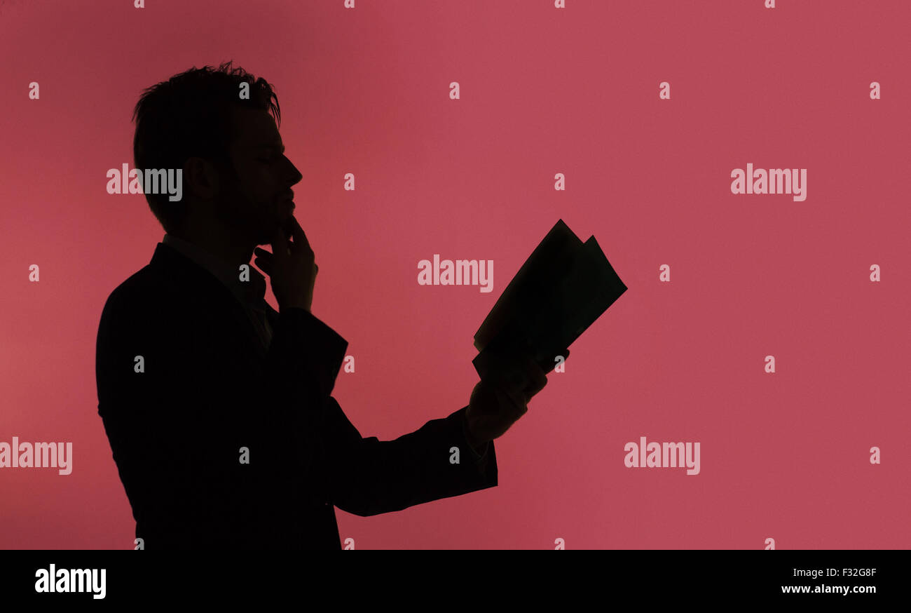 Young guy reading the comic book Stock Photo - Alamy