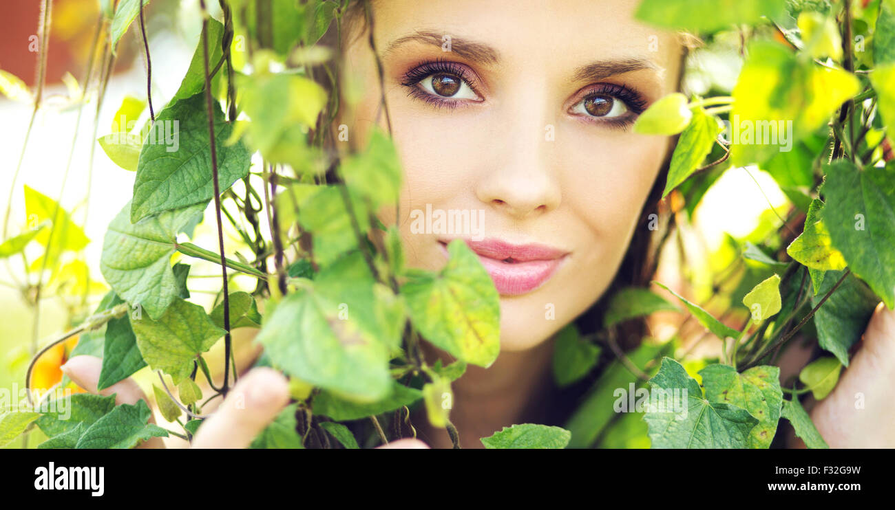 Marvelous lady among the greenery Stock Photo - Alamy
