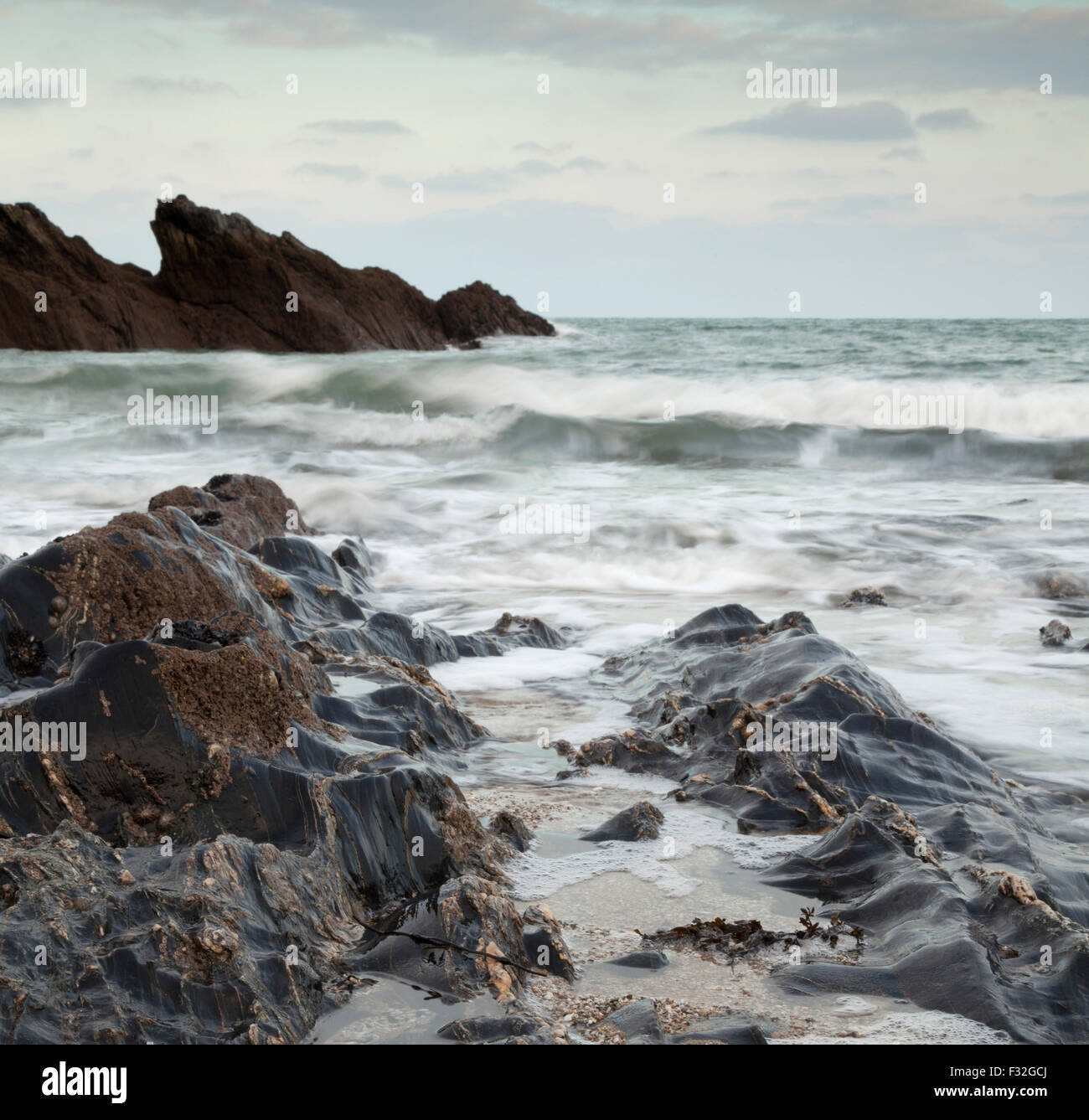Sea washing over rocks Stock Photo - Alamy