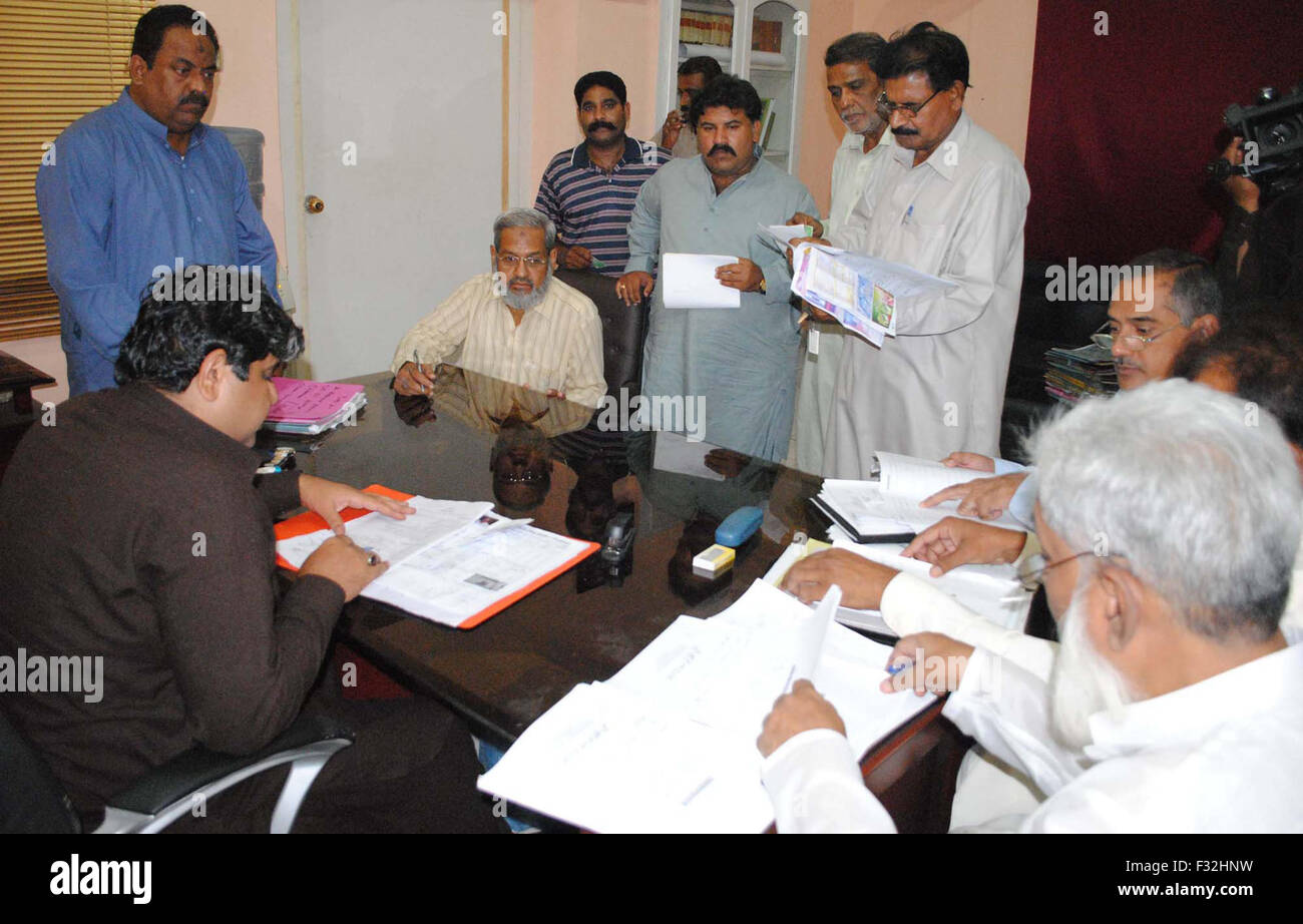 Regional Election Commission officer checking nomination papers of ...