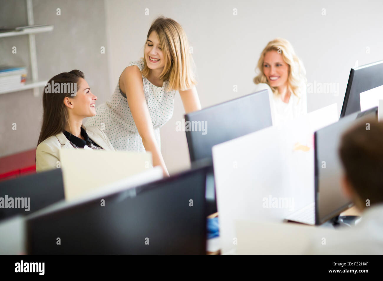 Young women in the office Stock Photo - Alamy