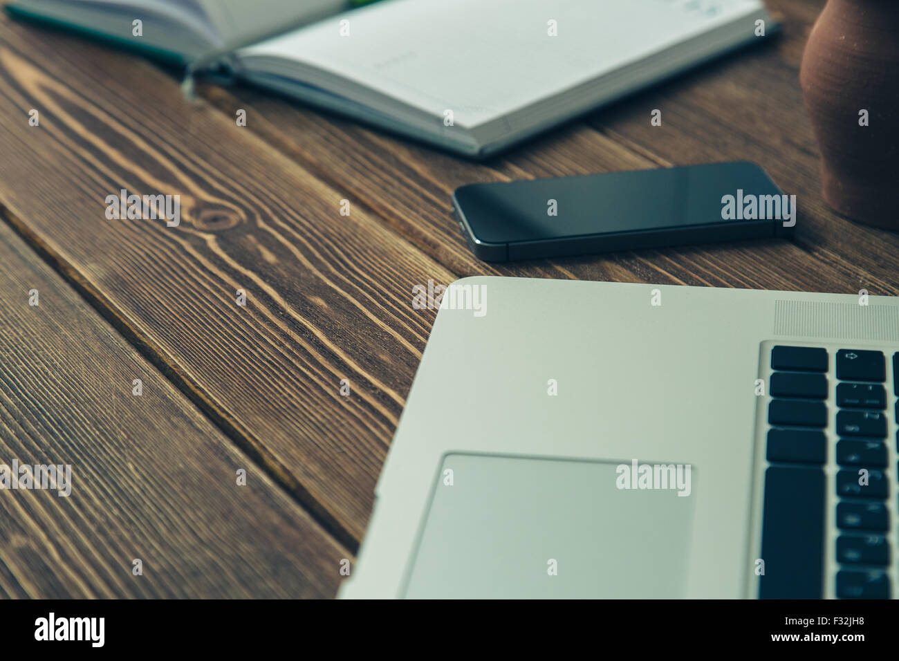 Laptop and diary on the desk Stock Photo - Alamy