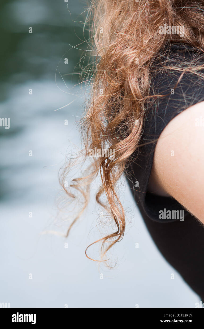closeup of a single long curl of blondish hair Stock Photo - Alamy