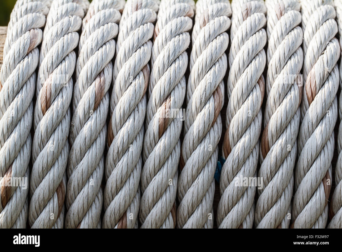 rope tied around a wooden log Stock Photo - Alamy