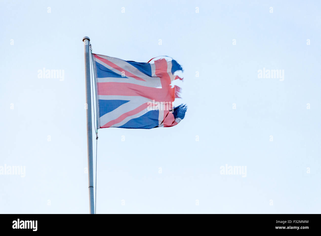Ripped Union Jack. Torn UK flag in tatters suggesting a Brexit outcome ...