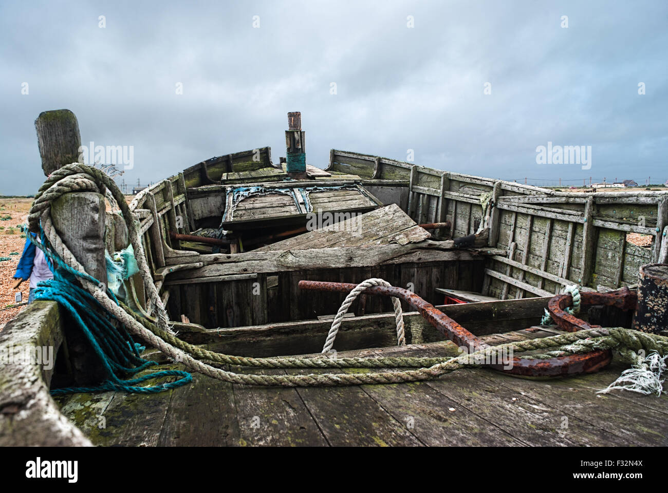 Abandoned fishing boat left to rot and decay on the beach at Dungeness ...