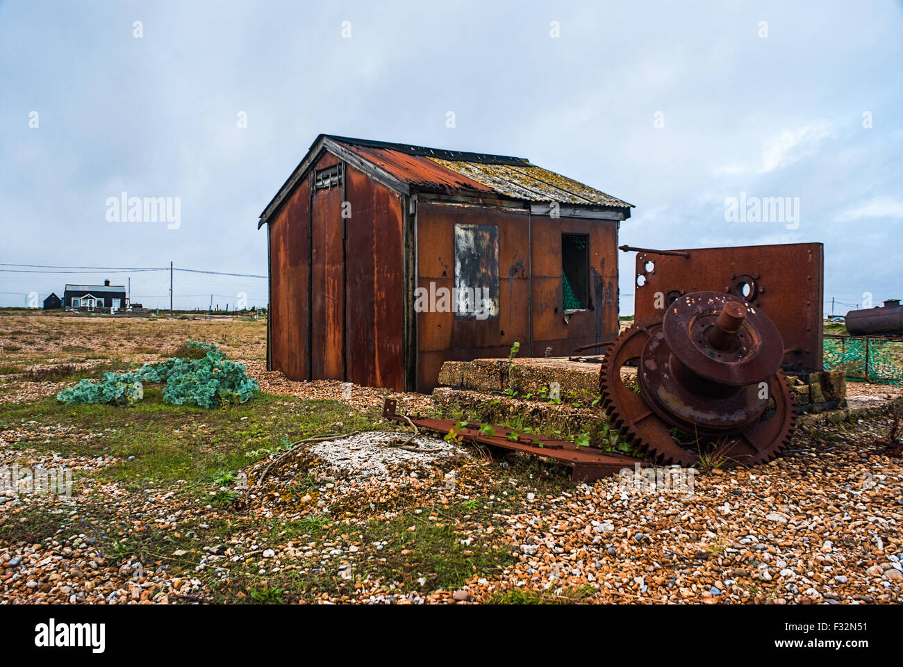 Abandoned rusting hut left to rot and decay on the beach at Dungeness ...