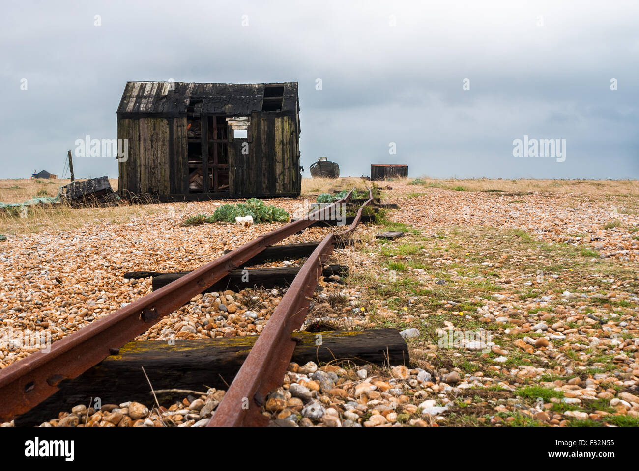 Abandoned hut left to rot and decay on the beach at Dungeness, Kent. A ...