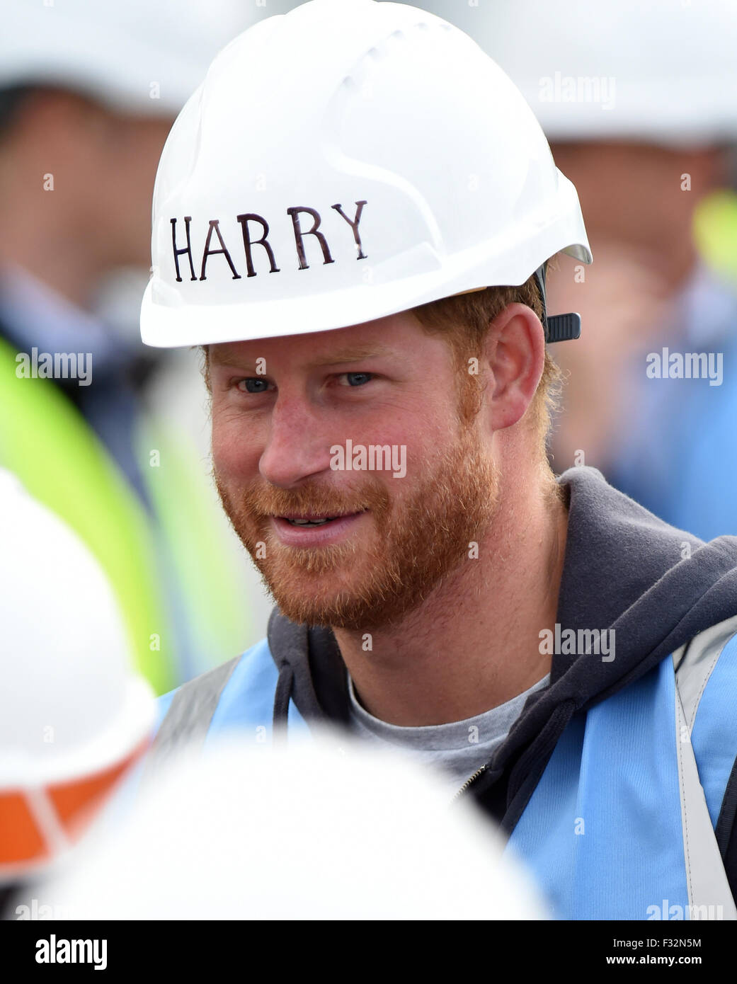 HRH Prince Harry wears a hard hat while visiting a building site Stock ...