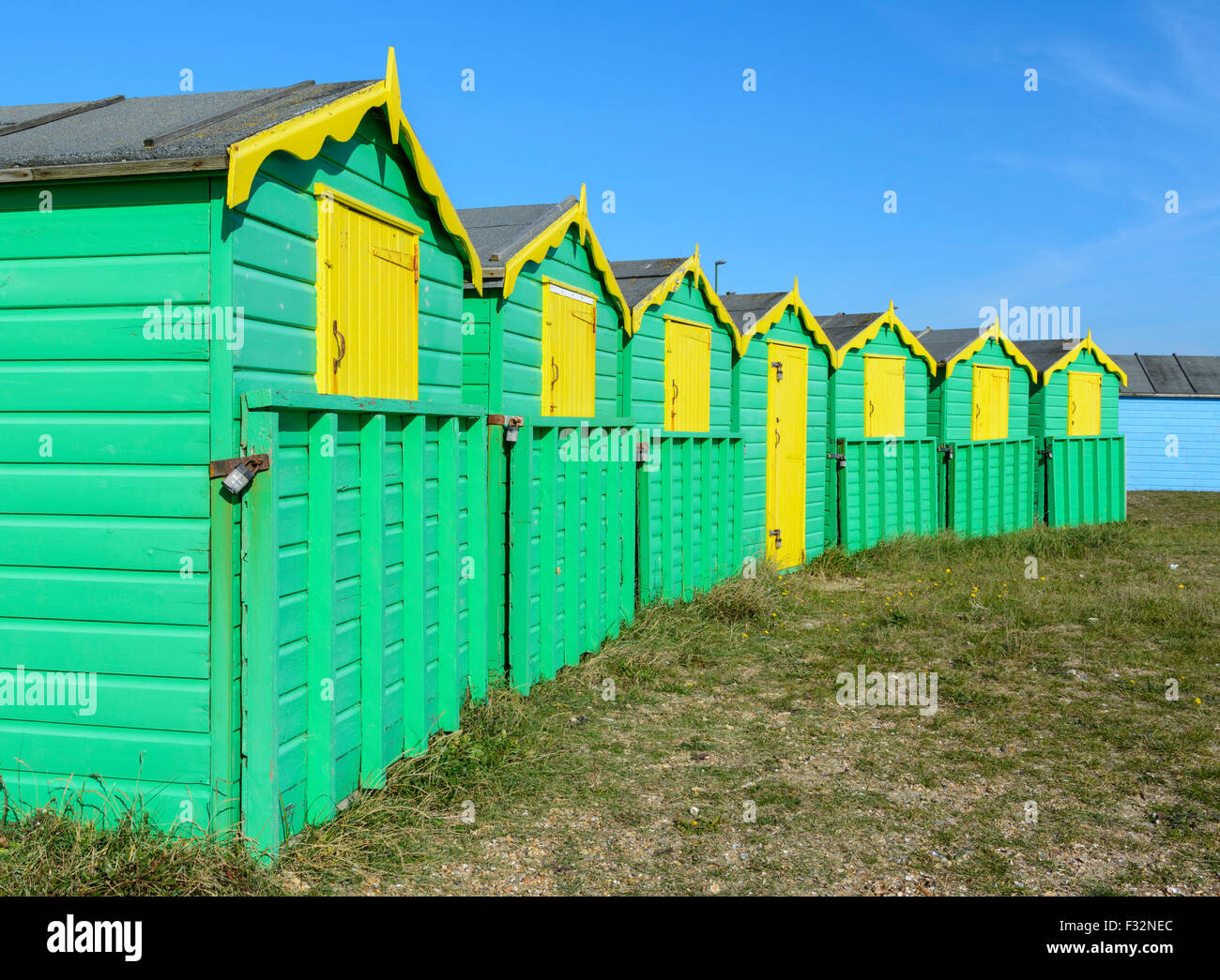 Beach huts UK. Beach huts on a sunny day with blue sky in Littlehampton ...
