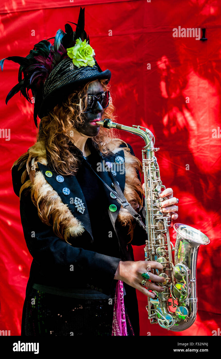 Beorma Border Morris dancer in costume with her saxophone Stock Photo ...