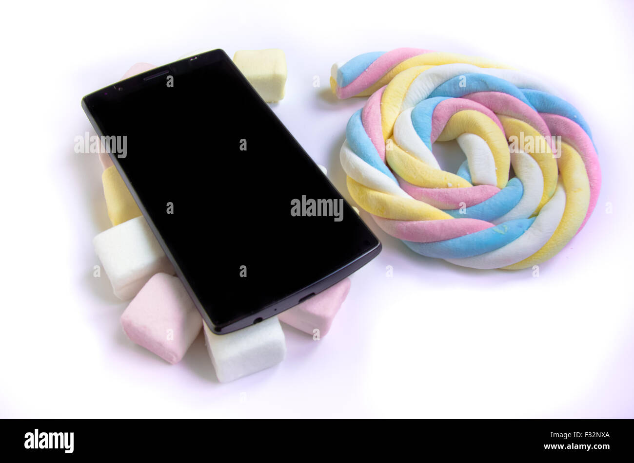 Mobile phone with colored marshmallows candies Stock Photo - Alamy