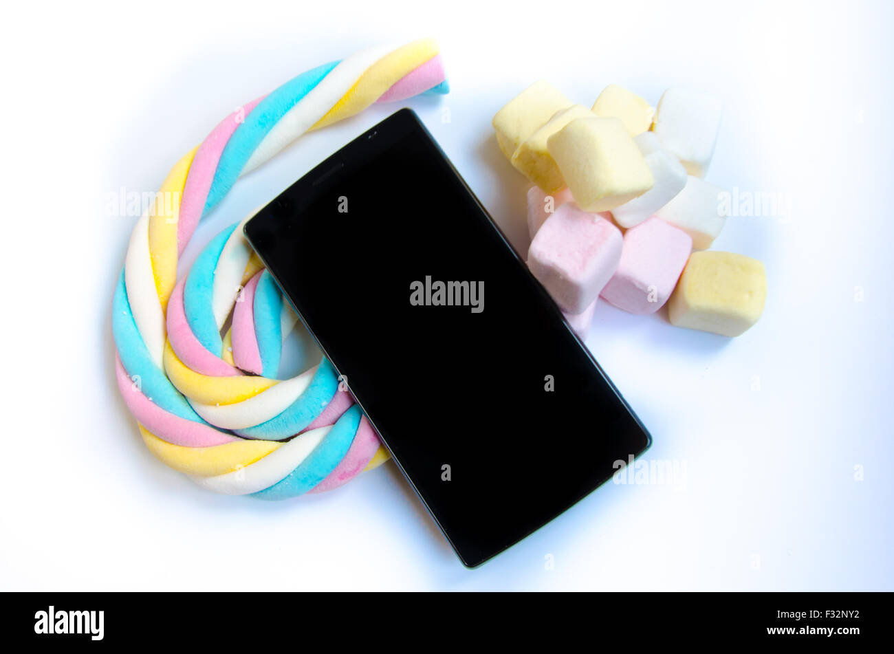 Mobile phone with colored marshmallows candies Stock Photo - Alamy