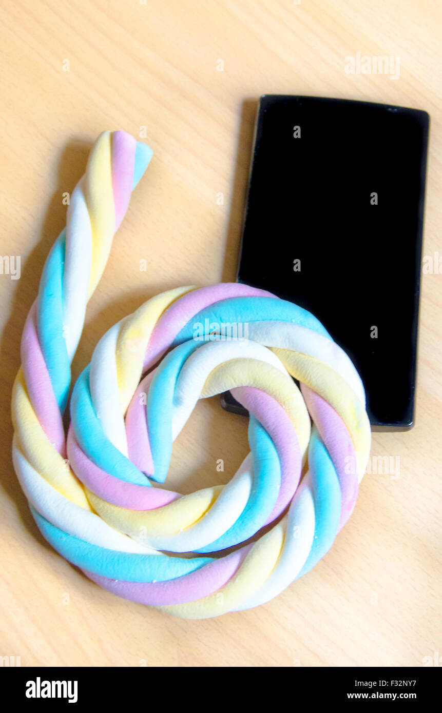 Mobile phone with colored marshmallows candies Stock Photo - Alamy