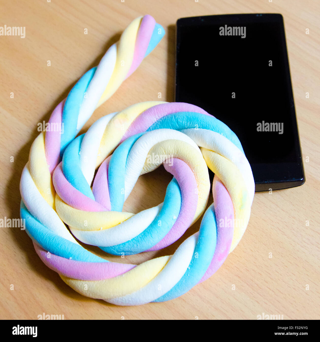 Mobile phone with colored marshmallows candies Stock Photo - Alamy