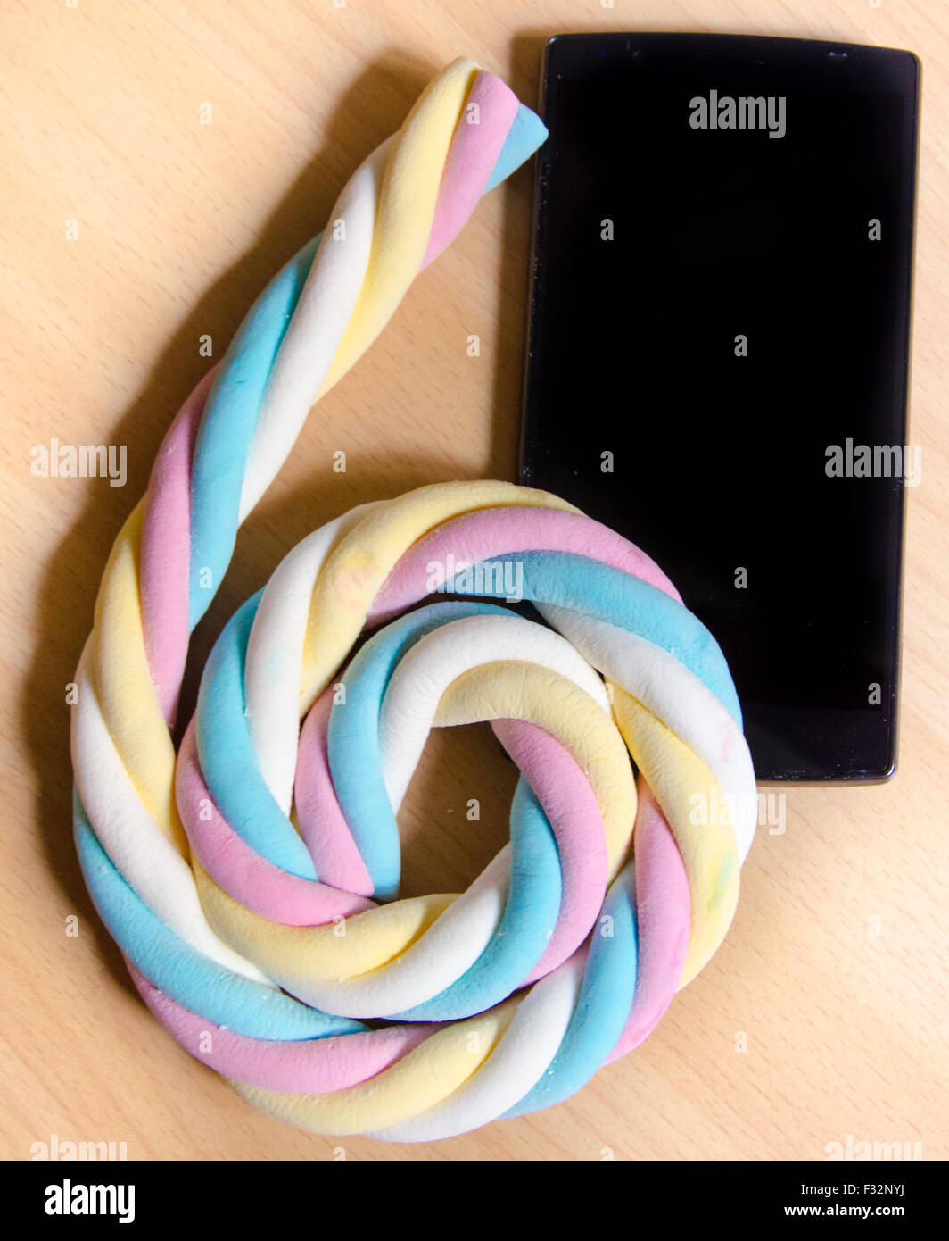 Mobile phone with colored marshmallows candies Stock Photo - Alamy