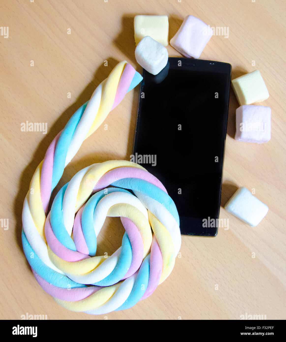 Mobile phone with colored marshmallows candies Stock Photo - Alamy