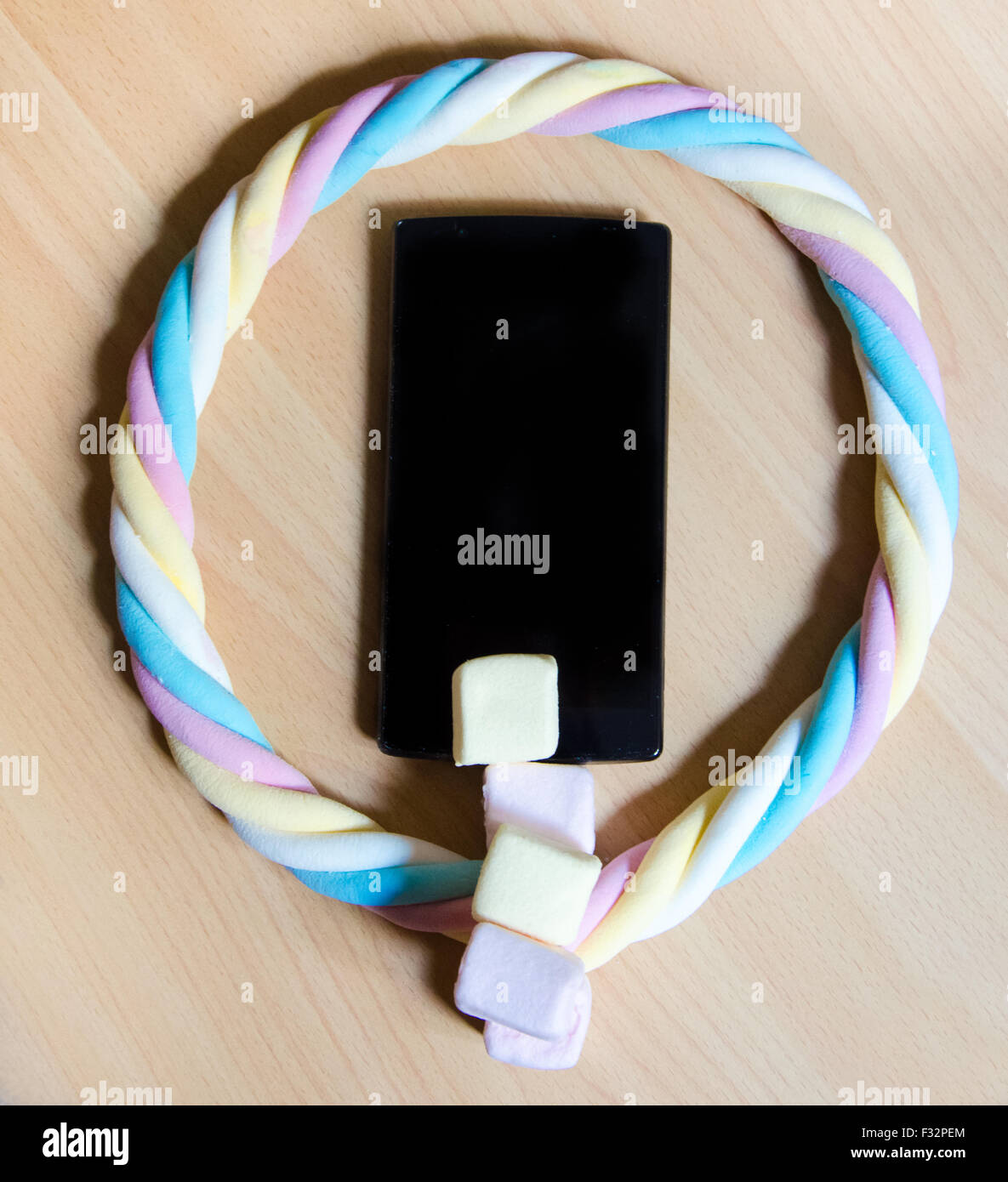 Mobile phone with colored marshmallows candies Stock Photo - Alamy