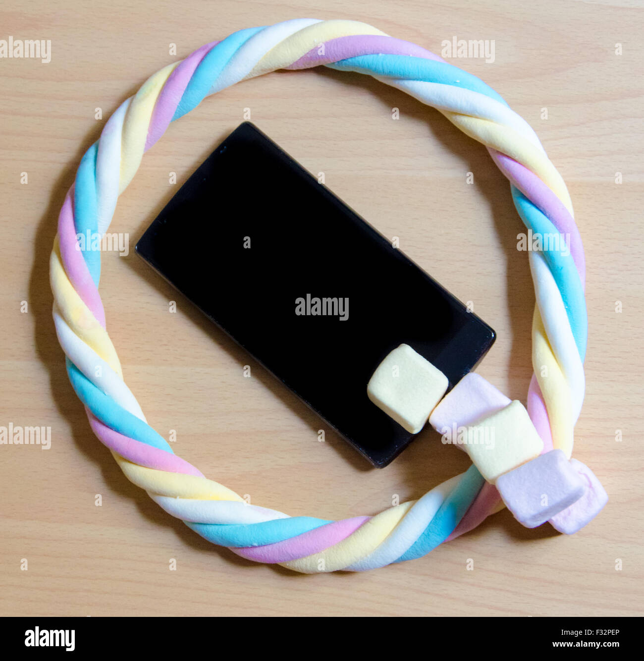 Mobile phone with colored marshmallows candies Stock Photo - Alamy