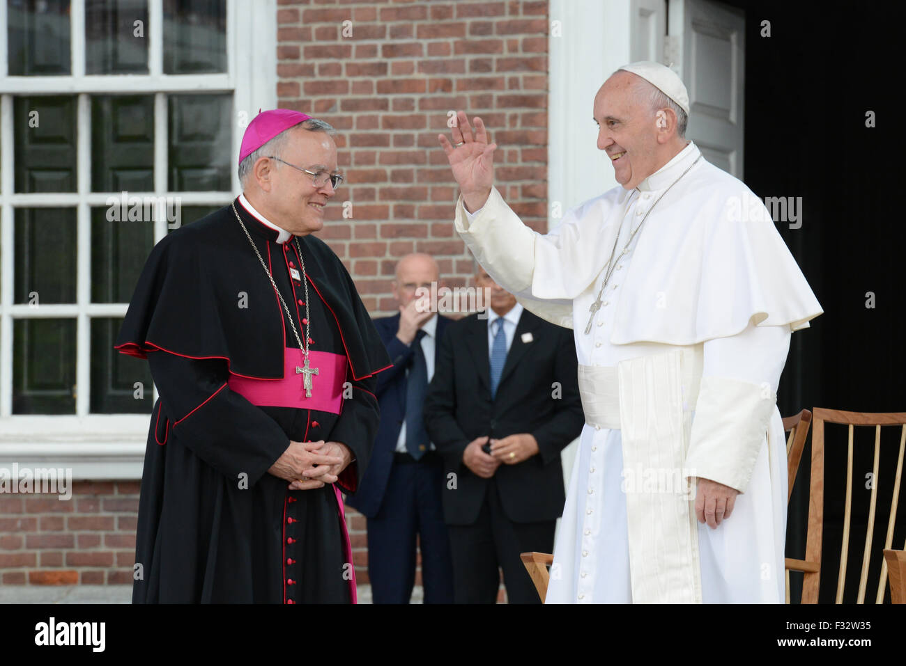 Pope Francis accompanied by Archbishop Charles Chaput address crowds ...