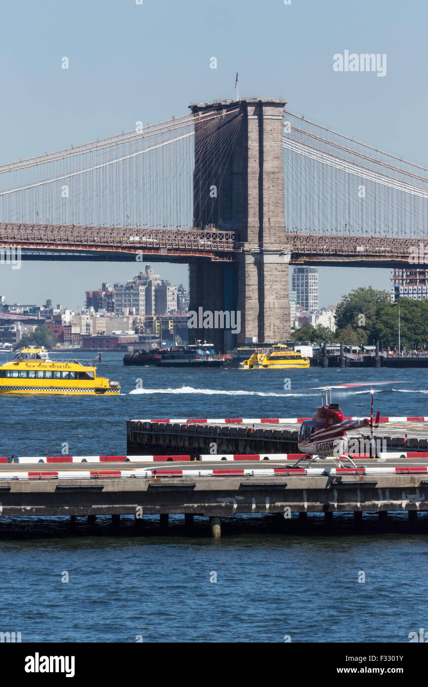 Downtown Manhattan Heliport and Helicopters, East River, NYC, USA Stock ...