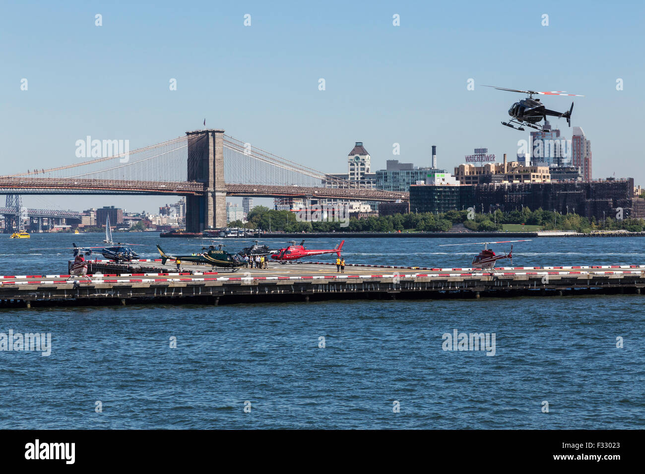 Downtown Manhattan Heliport and Helicopters, East River, NYC, USA Stock ...
