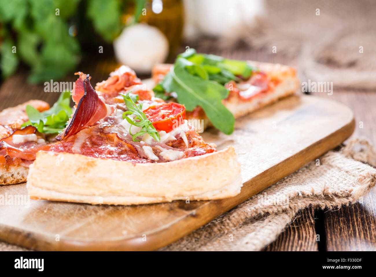 Homemade Ham Pizza slices (with rocket, fresh tomatoes, garlic and ...