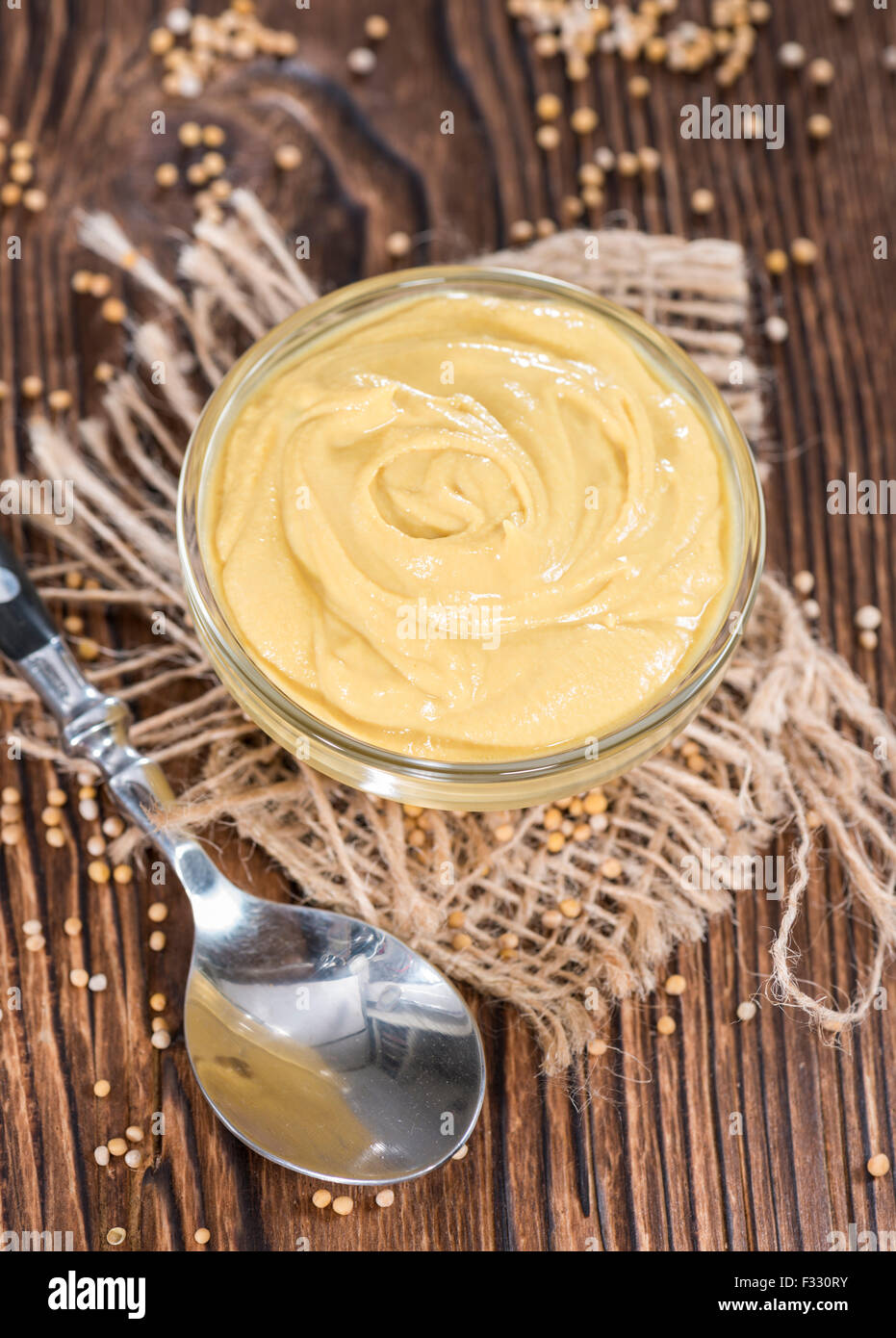 Portion of Mustard (on vintage wooden background Stock Photo - Alamy