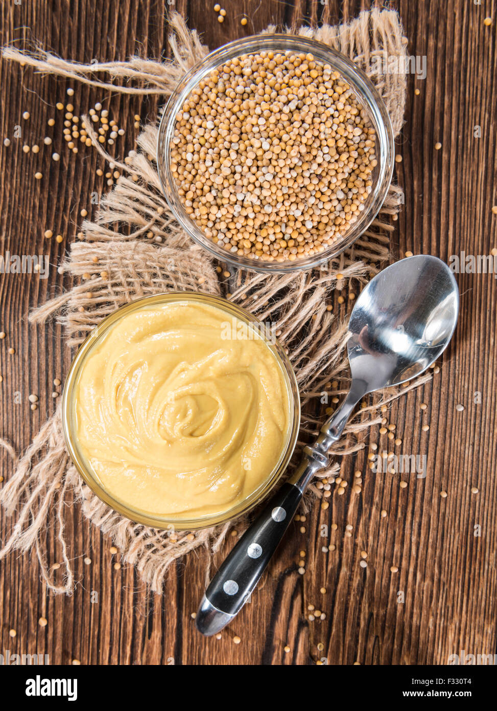 Portion of Mustard (on vintage wooden background Stock Photo - Alamy