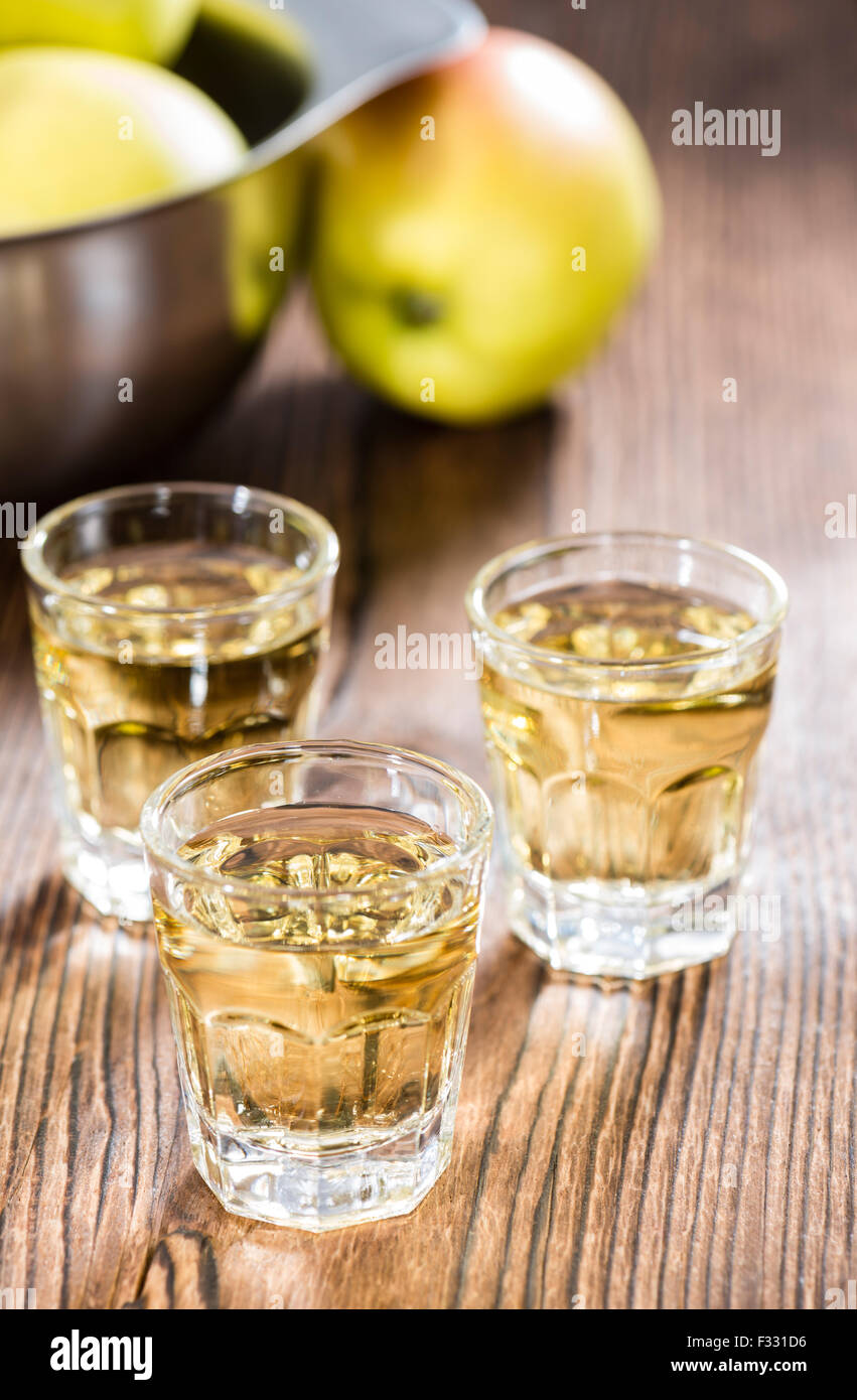 Apple Liqueur Shot (close-up shot) on dark wooden background Stock ...