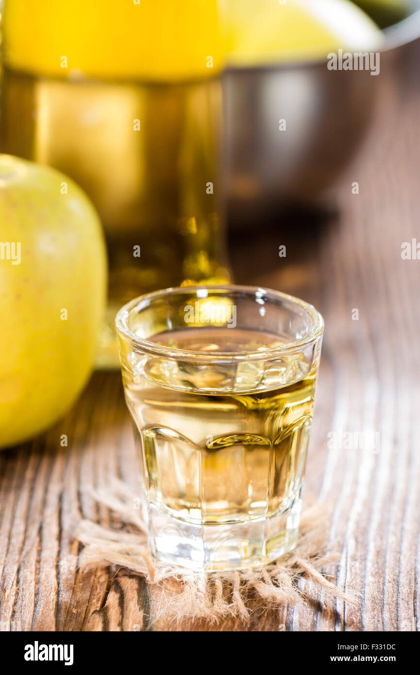 Apple Liqueur Shot (close-up shot) on dark wooden background Stock ...