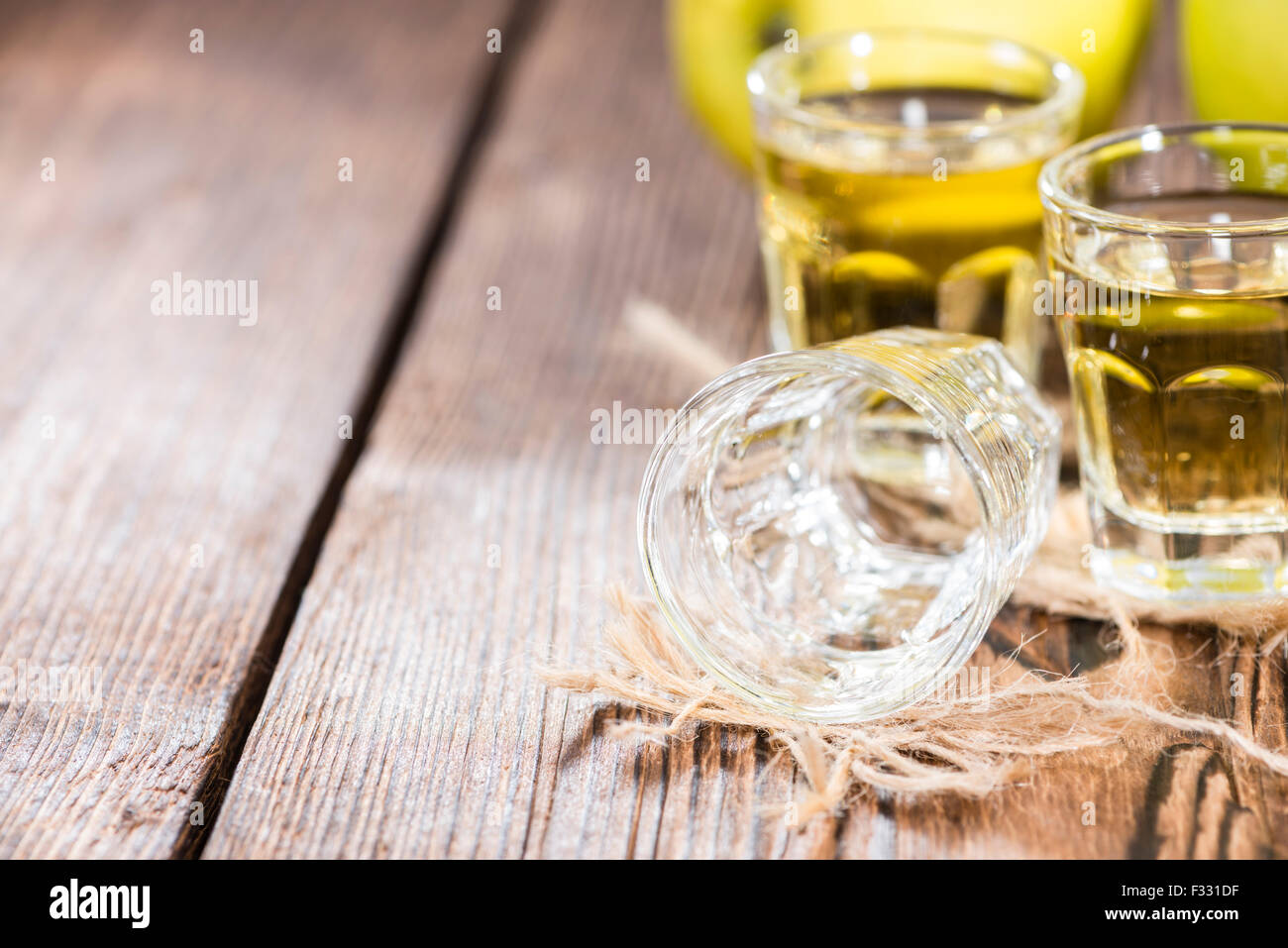 Apple Liqueur Shot (close-up shot) on dark wooden background Stock ...