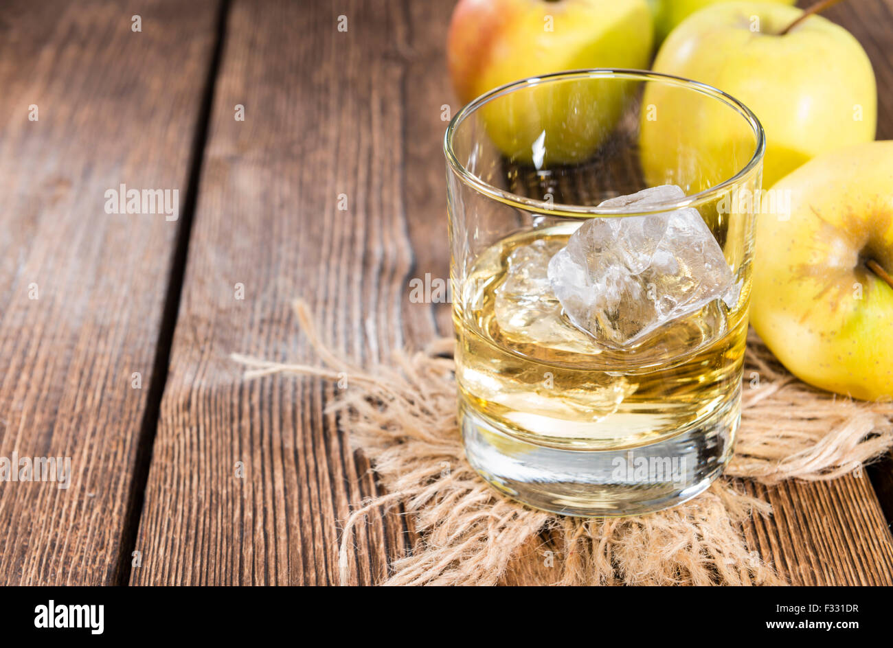 Glass with Apple Liqueur on dark vintage wooden background Stock Photo ...